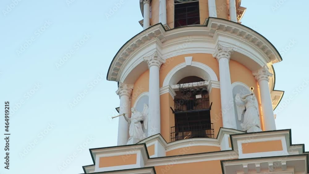Video Stock bell tower of peach color with white edging, the sky is ...