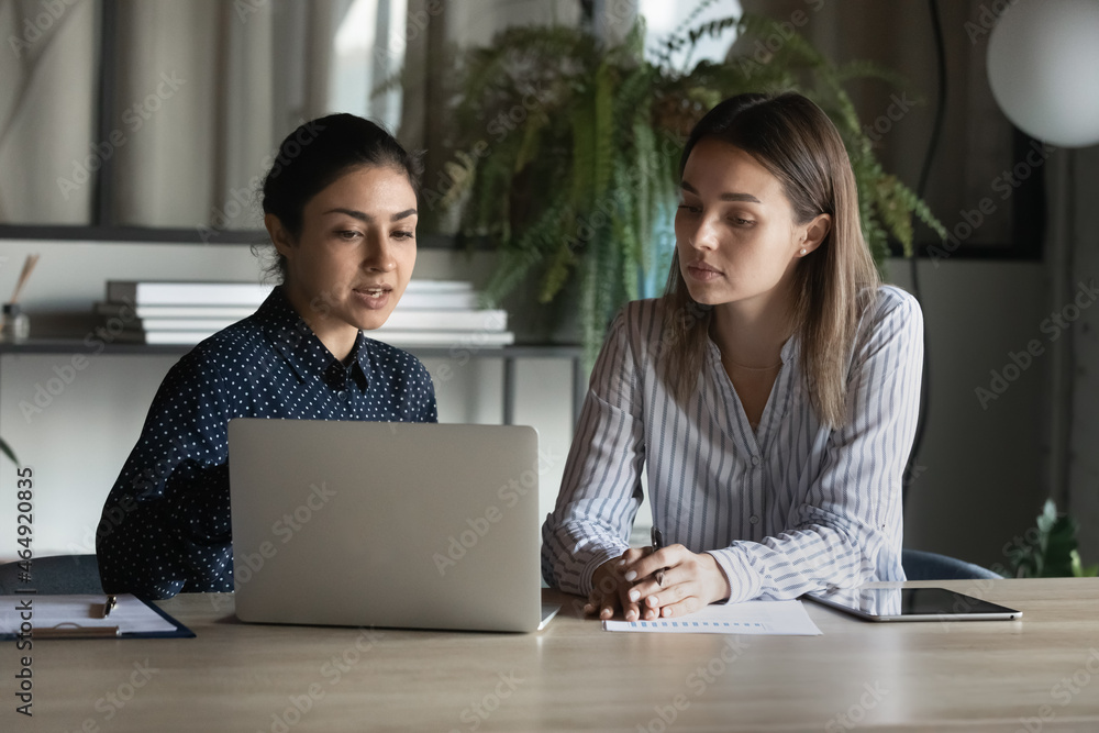 Young lady apprentice intern listen to confident female mentor of ...