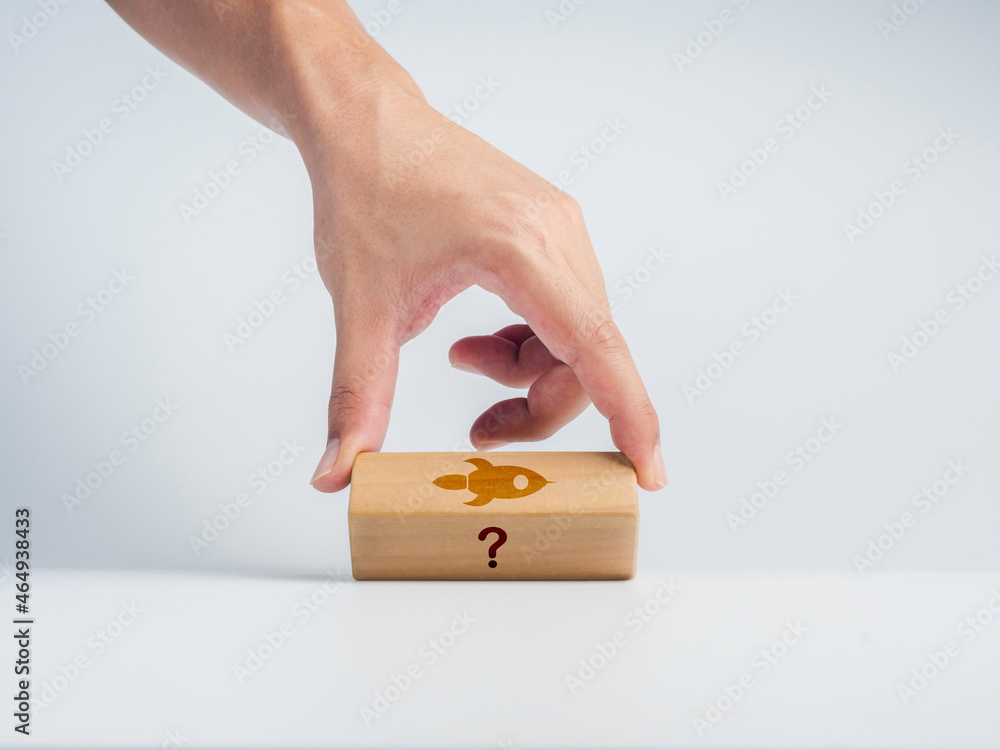 Business startup concept. The man's hand flipping wooden block with ...
