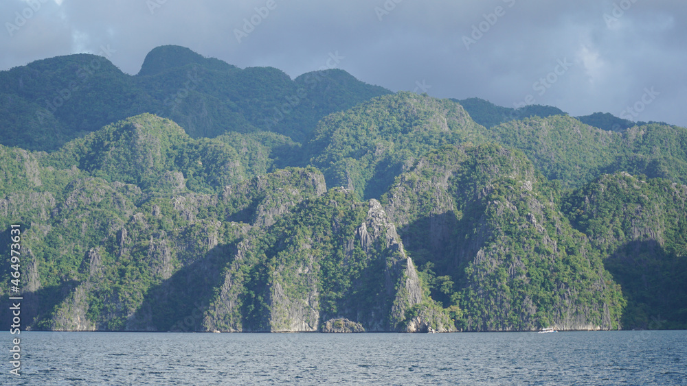 Ocean and jagged rock landscapes with turquoise water at Coron Island ...