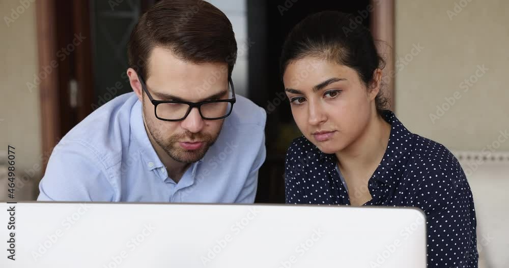 Internship. Confident male mentor in glasses explain work details to ...