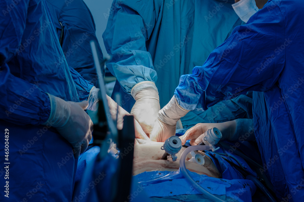 Selective focus on the hand of a surgeon wearing a sterile latex glove ...