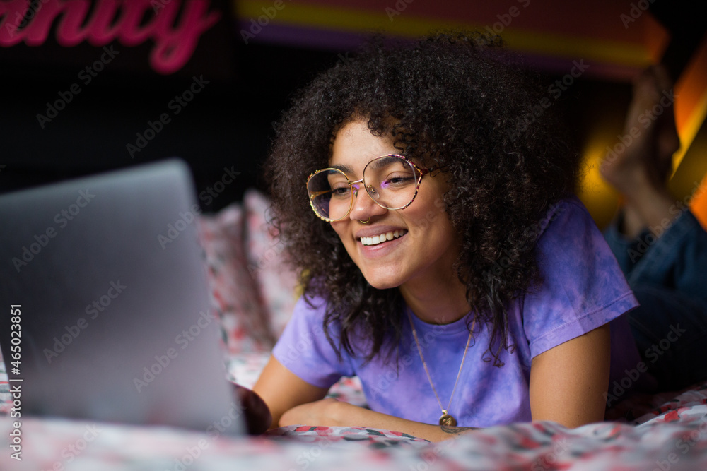 Young adult gen z female student using a laptop in her bedroom Stock ...