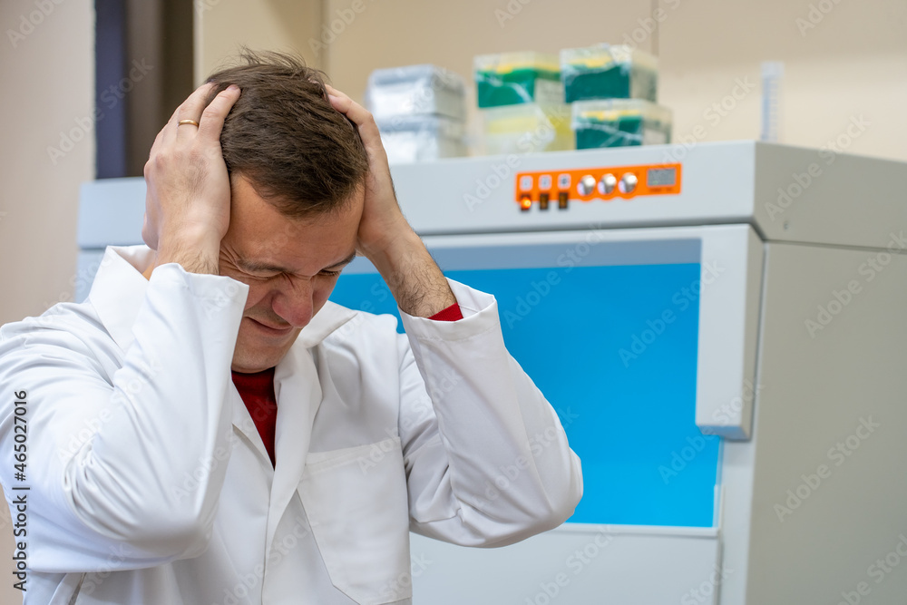 Millennial guy suffering migraine headache problem holding head with ...