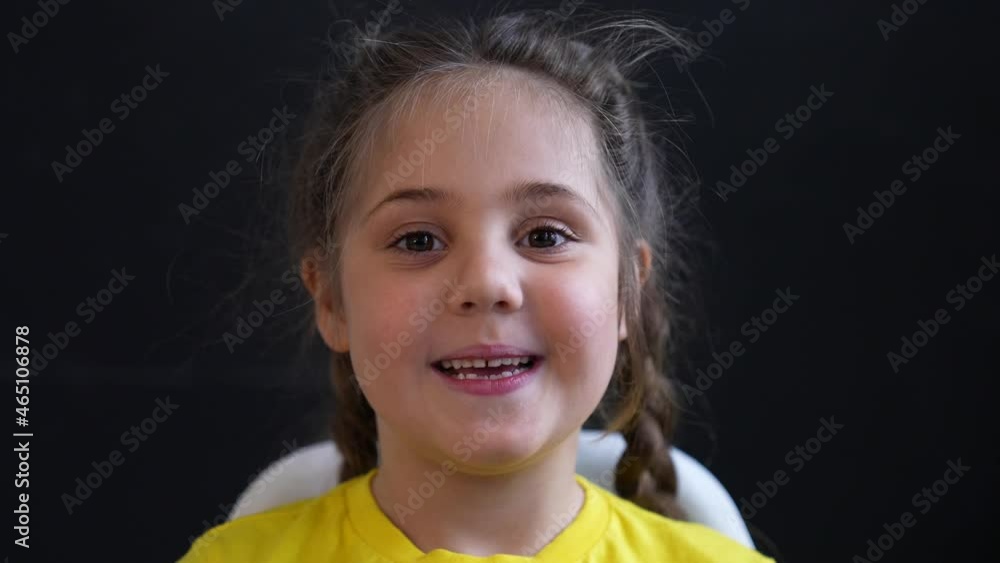 Happy little girl laughs. Cute baby face close up. Funny face of little ...