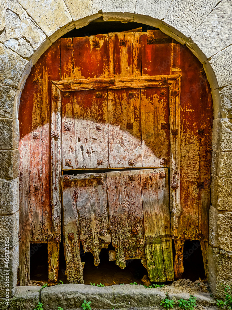 Old deteriorated wooden door in a neighborhood of Sos del Rey Catolico ...