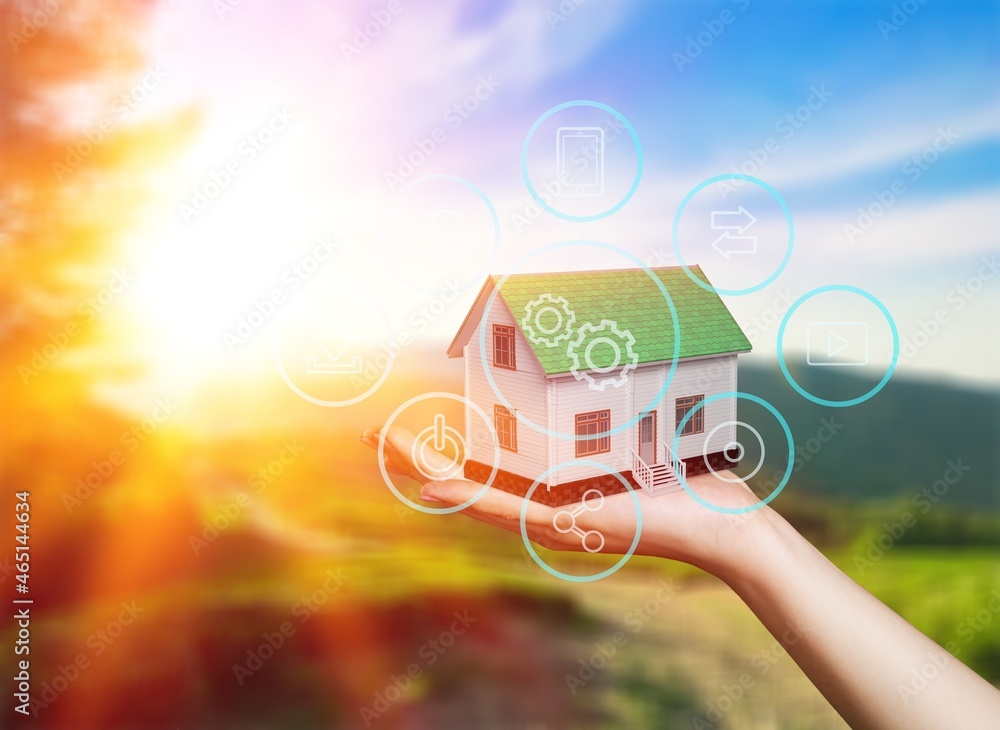 Miniature house in hand and symbols of public utilities. Stock Photo ...