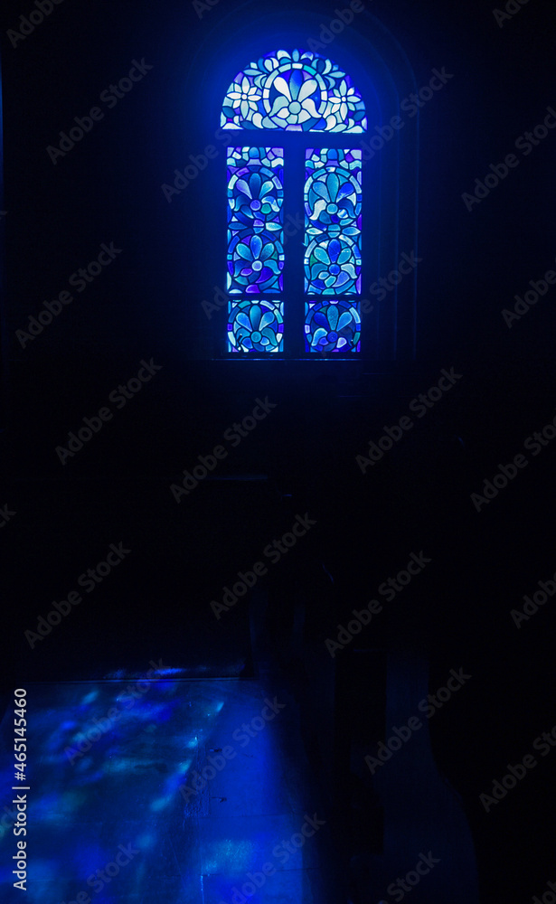 Light shining through stained glass window at a chapel Stock Photo ...