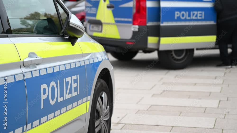 German police cars on the street. Side view of a police car with the ...