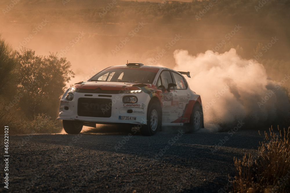 GRANADA, SPAIN - Sep 03, 2021: White racing car driving very fast as ...