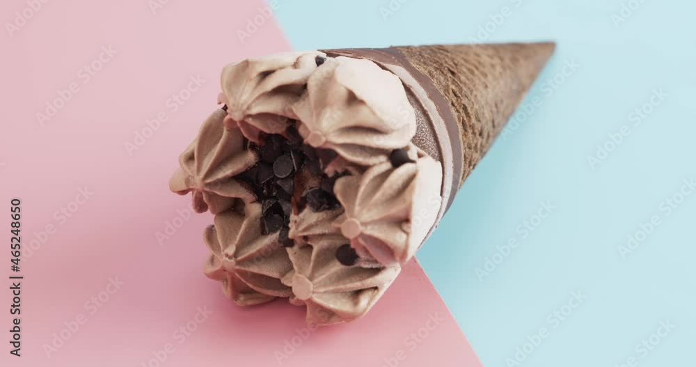 Zoom in, Chocolate ice cream on a waffle cone. Topping on top of ...