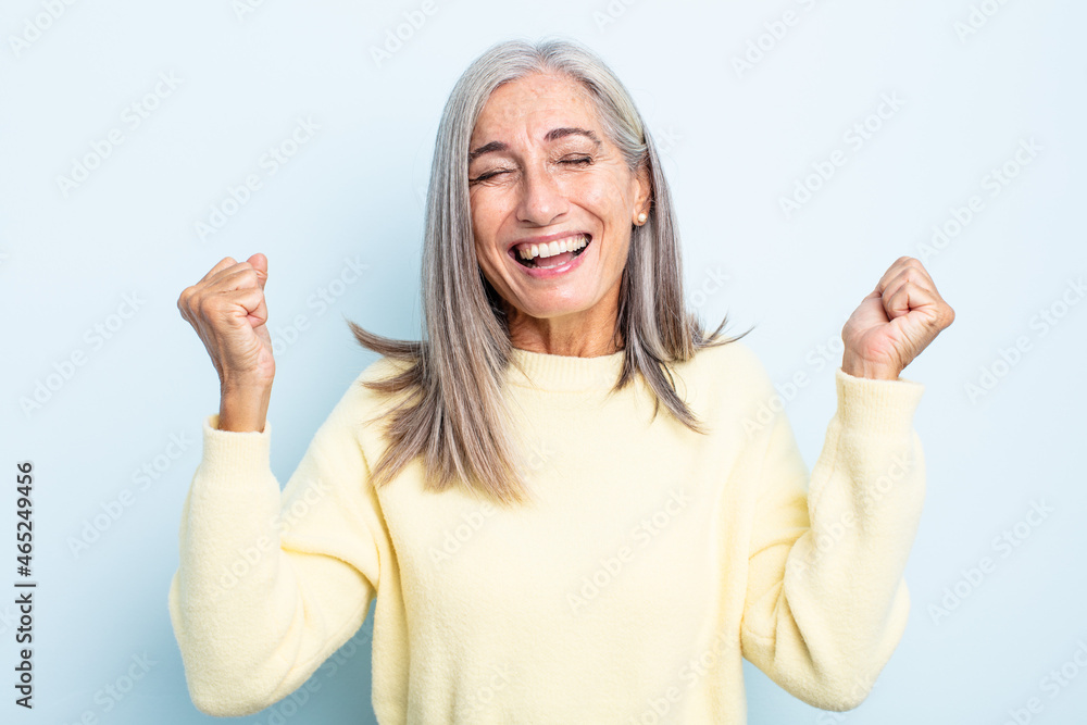 middle age gray hair woman looking extremely happy and surprised ...