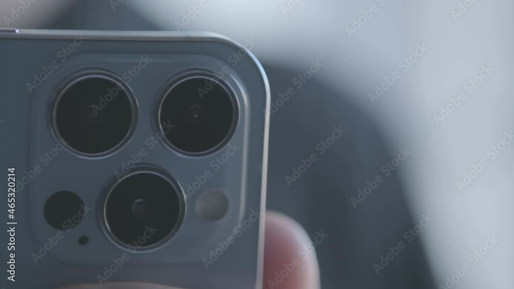 Filming 4K videos with new Iphone 13 Pro with three cameras. Man ...