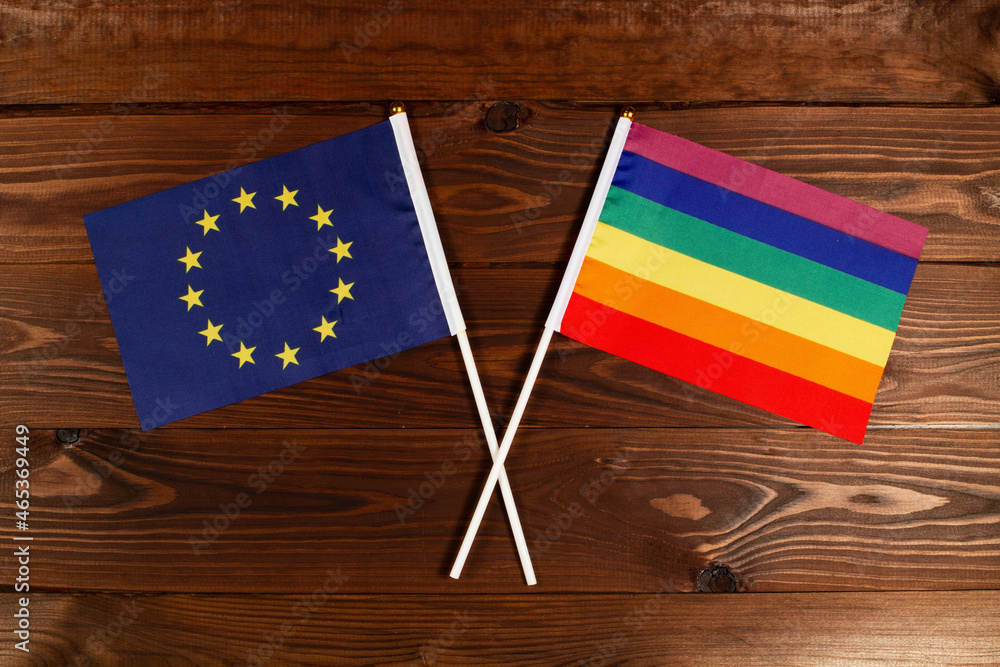 Flag of European Union and flag of LGBT crossed with each other. The ...