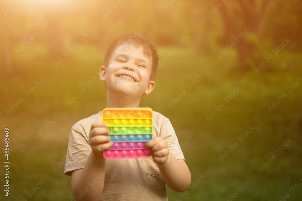 Gigglet Boy Has Fun With His Colorful Pop It and Sunbathes in the ...