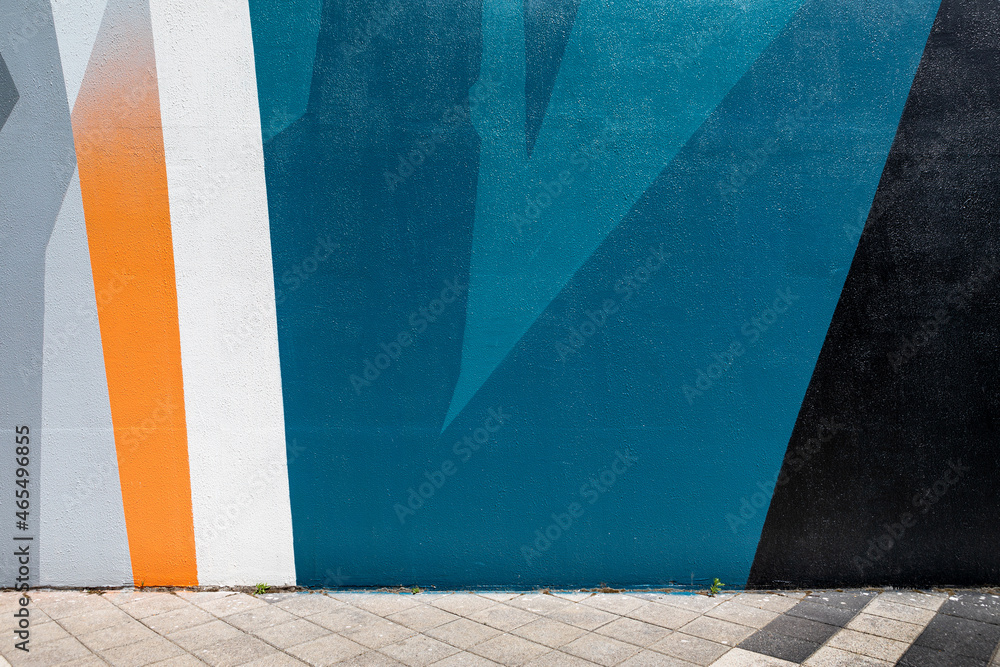 Modern urban scene with empty street and colorful geometrical wall ...