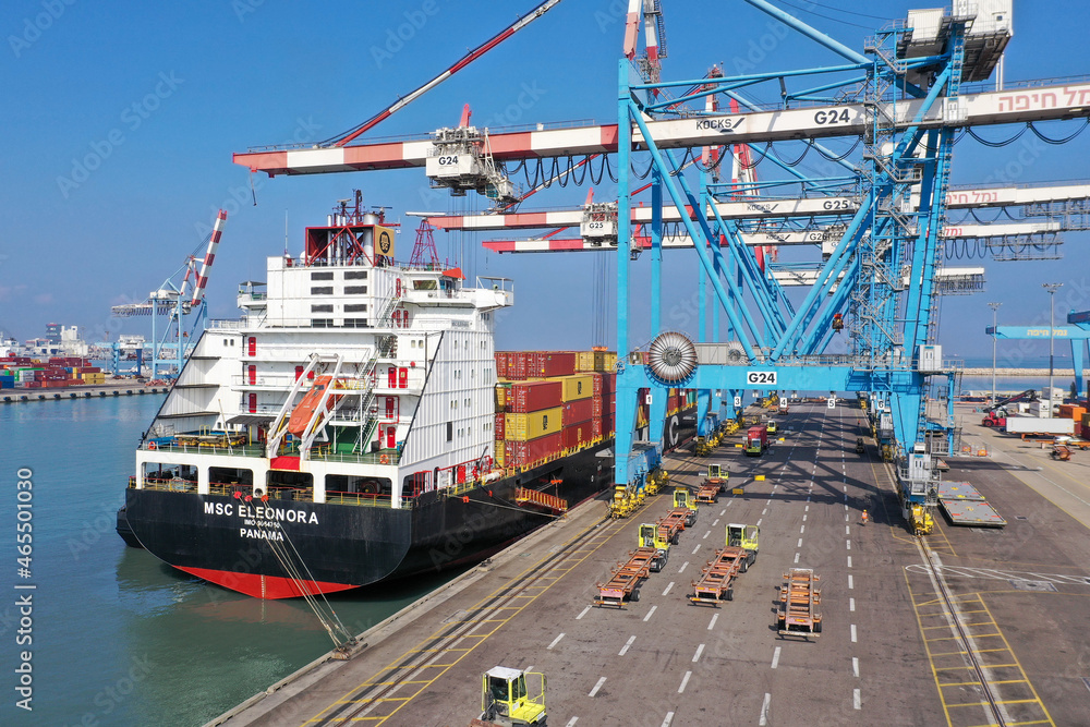 Port work environment with an MSC Container ship anchored during ...
