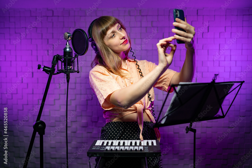 middle aged caucasian pop star singer in studio headphones in a room ... middle aged caucasian pop star singer in studio headphones in a room ...