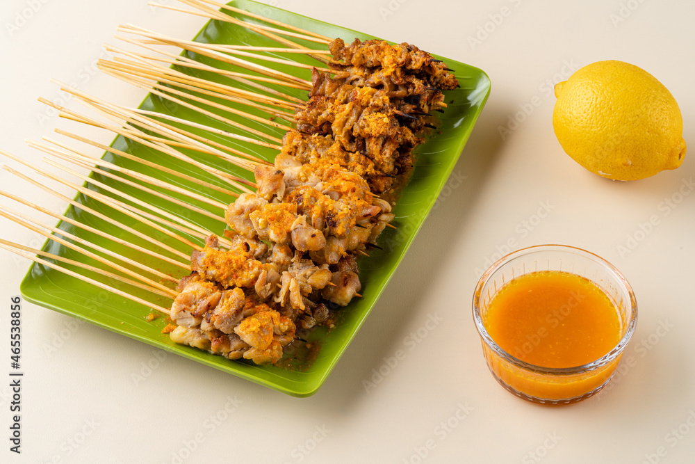Sate taichan or Taichan satay with grilled chicken skin is a variation ...