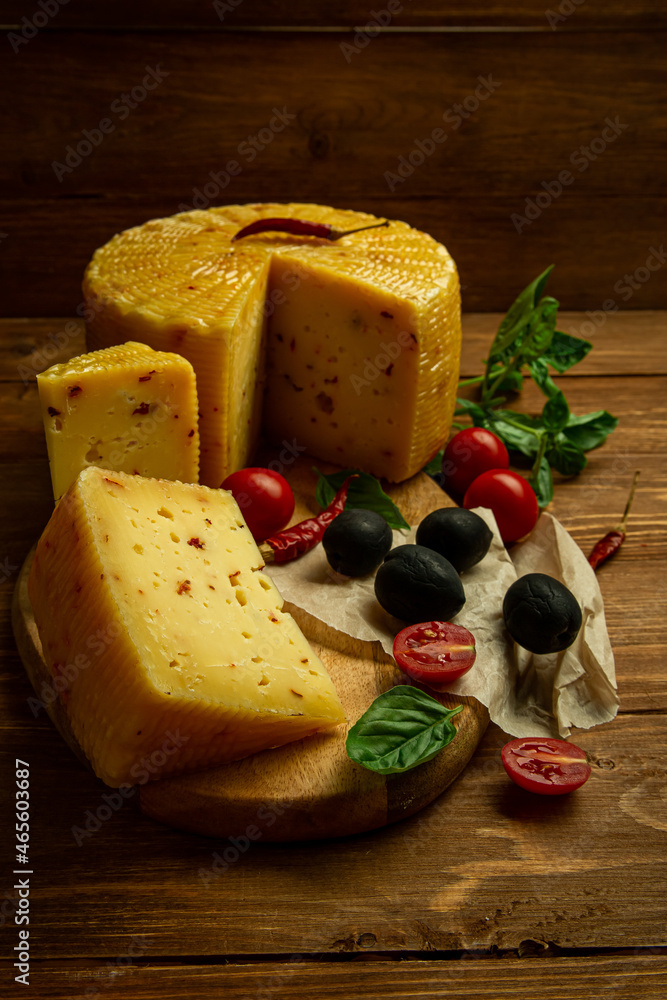 composition of different types of sliced cheese: hard, mature, cheese ...