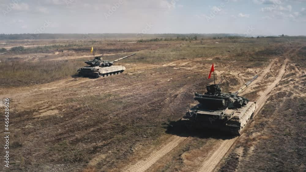 Tanks line ready for attack on battlefield road. Aerial panorama of ...