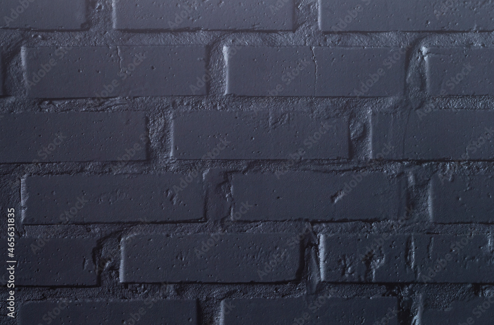 The photo shows a black clinker wall that can be used as a background ...