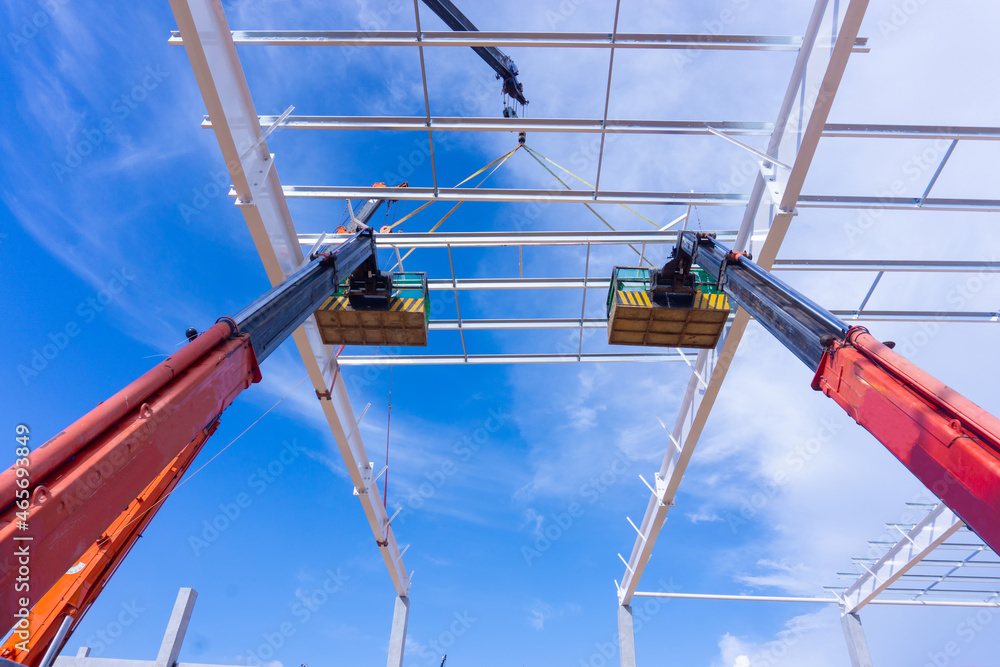 Steel structural work installation by mobile crane and boom lift ...