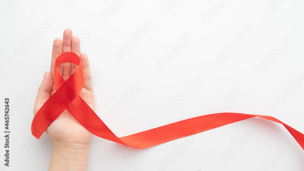 World AIDS day in December month campaign. Human hands holding red ...