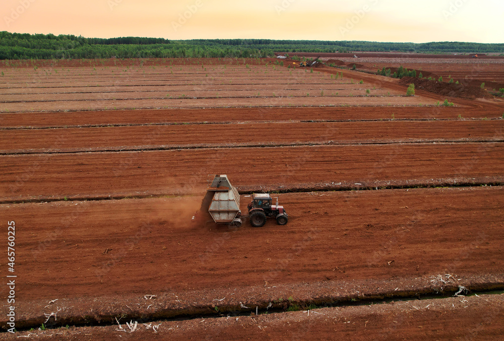 Peat Harvester Tractor on Collecting Extracting Peat. Mining and ...