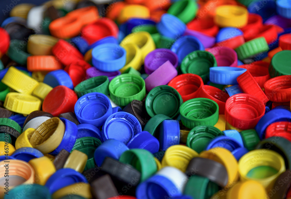 Plastic bottle caps background. Cap material is recyclable.Remove lids ...