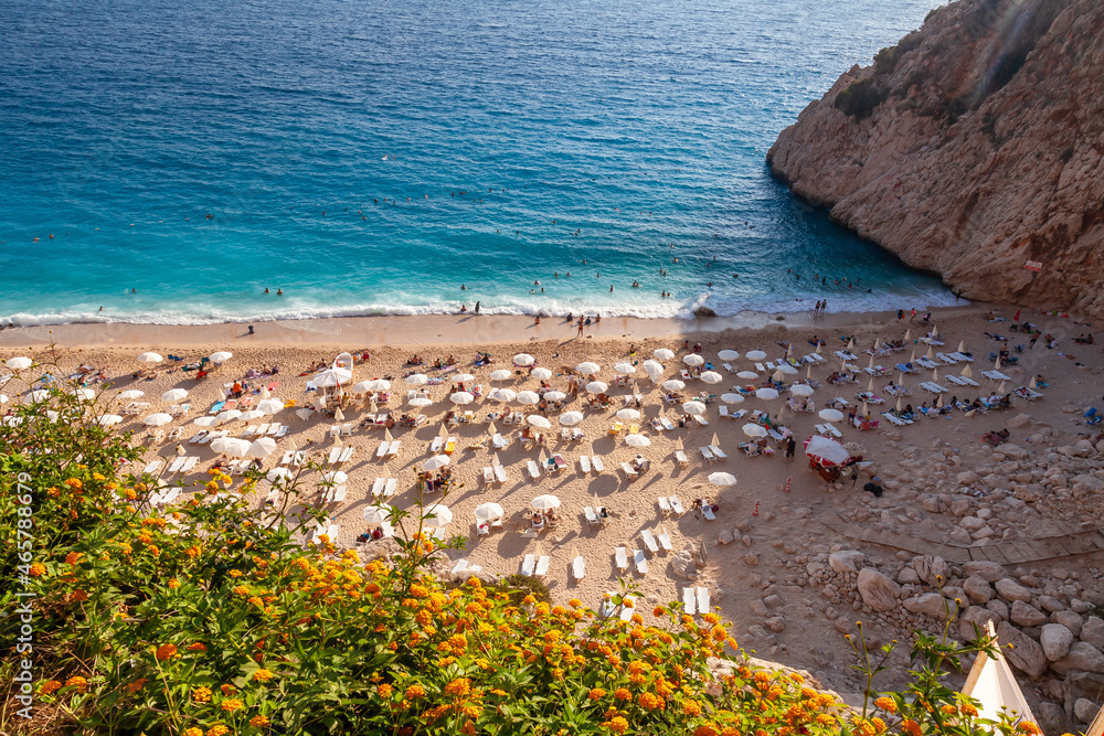 People crowd relaxing on beach. Swimming people in sea. Top view of ...