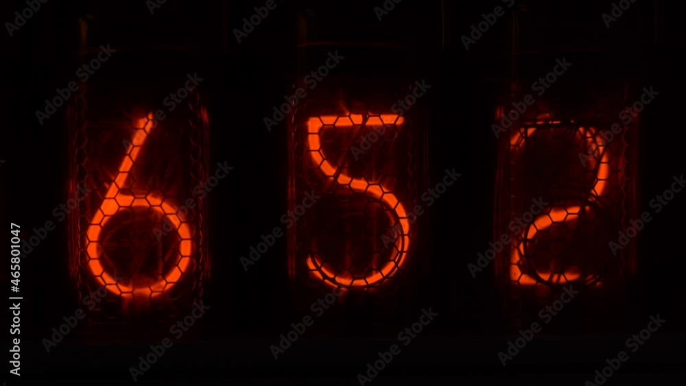 Retro vacuum tube display on the device counts seconds. Displaying ...