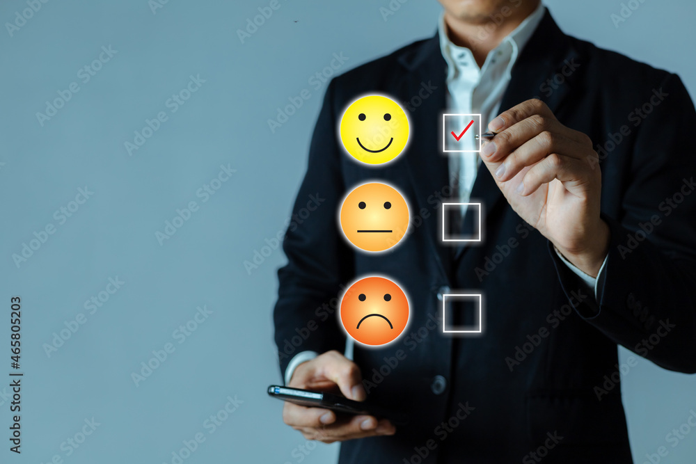 Businessman hand putting check mark a checkbox on excellent smiley face ...
