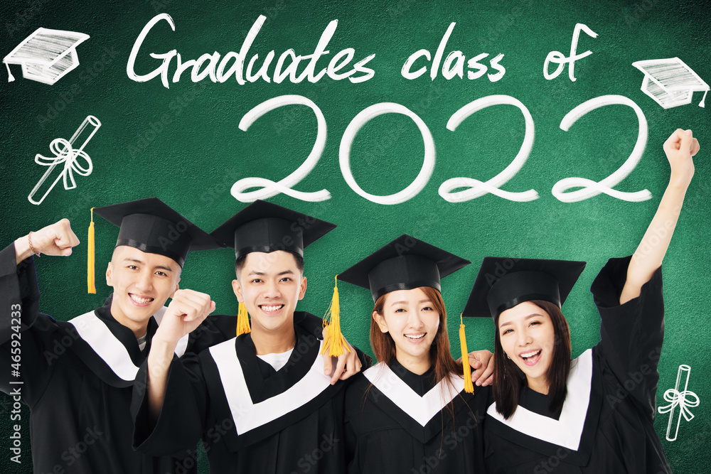 Group of graduating students standing together and class of 2022 ...