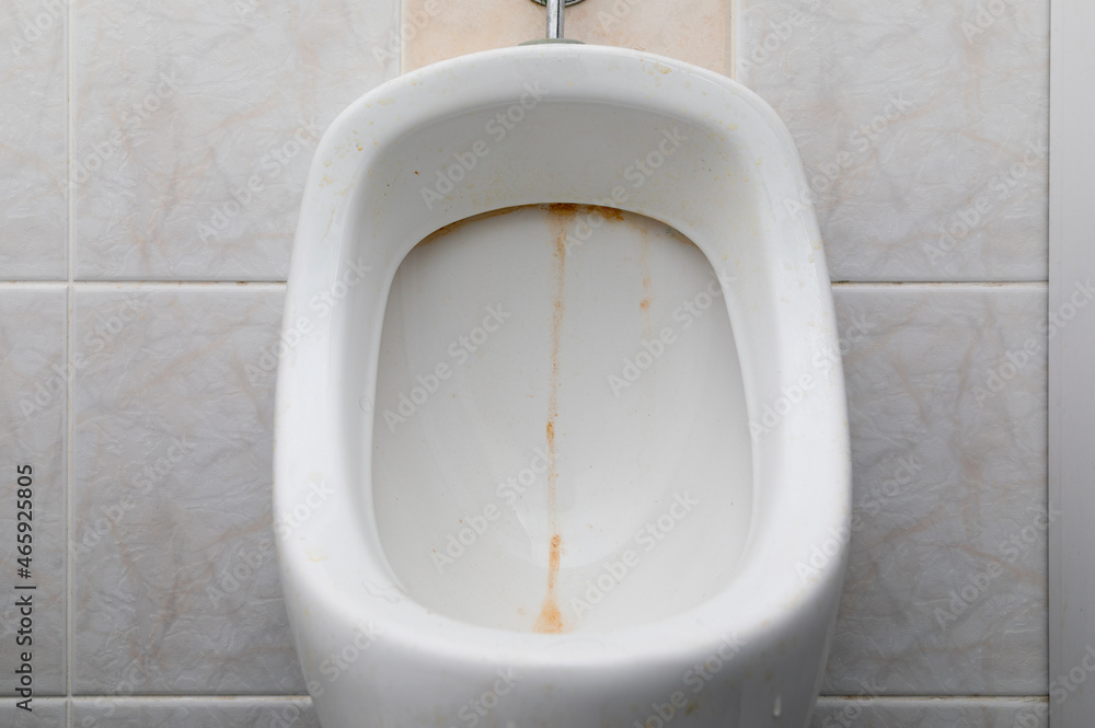 a urinal in a public toilet, traces of dirt and limescale Stock Photo ...