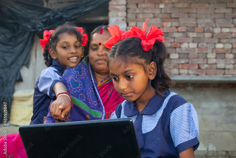 indian village government school girl operating laptop computer system ...