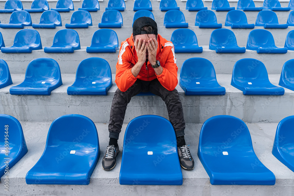 fan is disappointed with the loss of his favorite team. One person in ...