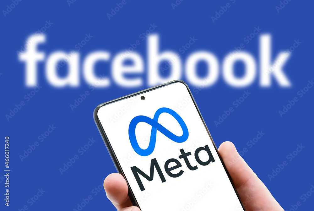 Meta logo on screen of mobile phone on Facebook word background Stock ...