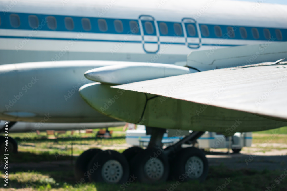 The wing of the plane. Hull, chassis, engines and propellers of an old ...