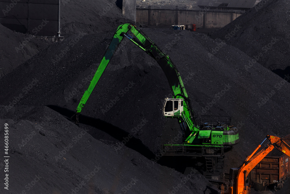 Industrial loading of coal into railway cars. Coal port of the city of ...