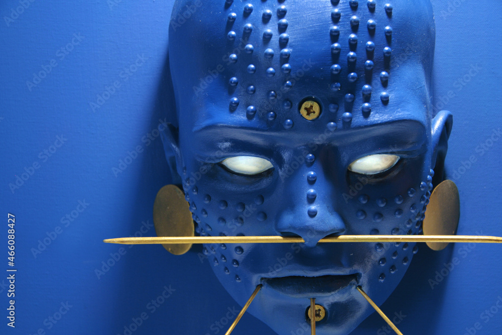 Blue-skinned gods. Face sculpture, inspired by Hindu figures. Golden ...