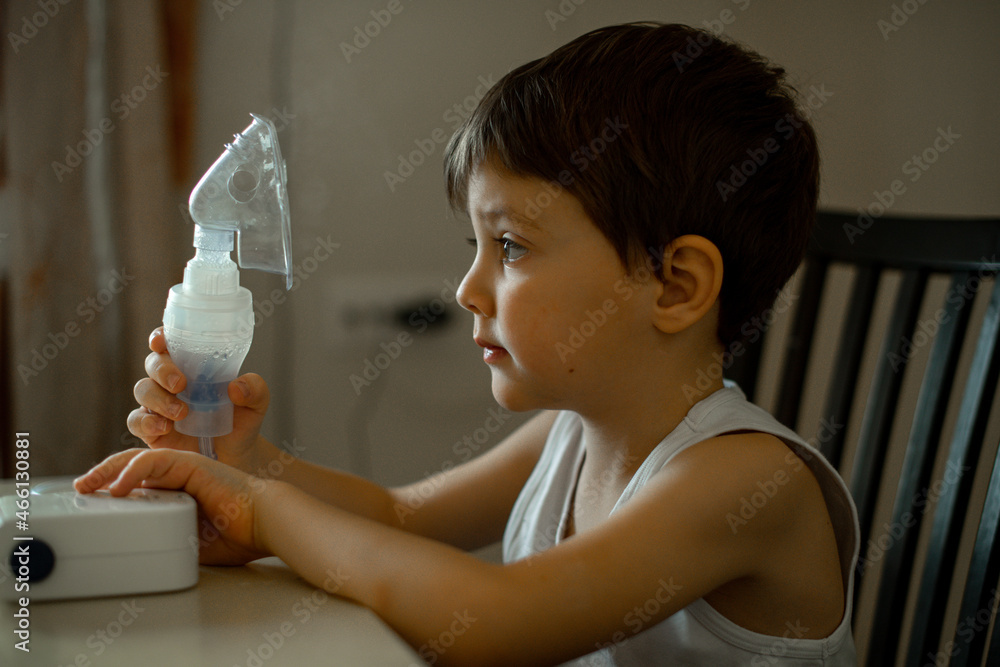 the boy got sick, the child treats cough with an inhaler Stock Photo ...