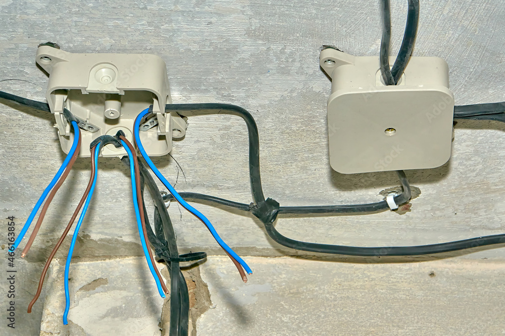 Laying and connection of electrical wires in the external junction box ...