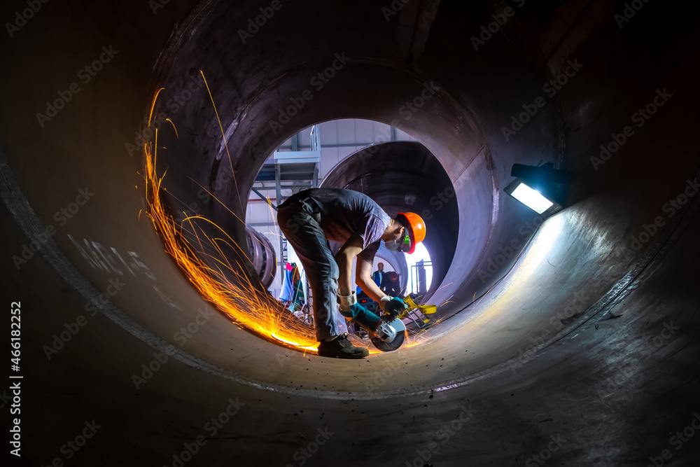 Manufacturing of steel pipes in one of the plant's workshops. Rotation ...