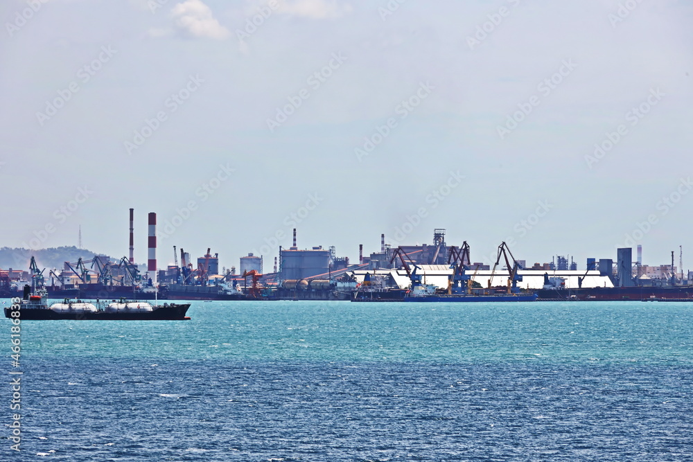 Vessels, bulk carrier and tugboats at the port under cargo operations ...