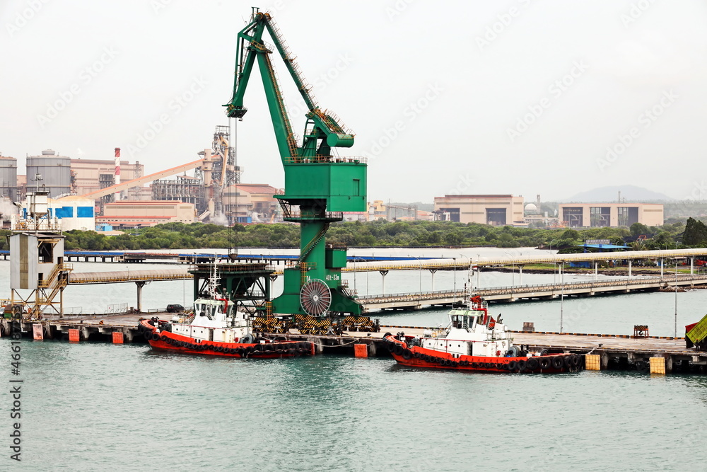 Vessels, bulk carrier and tugboats at the port under cargo operations ...