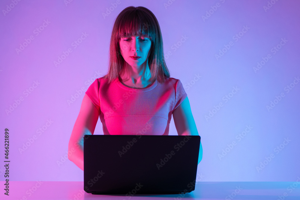 Girl with laptop. Woman is typing something. Woman office worker in ...
