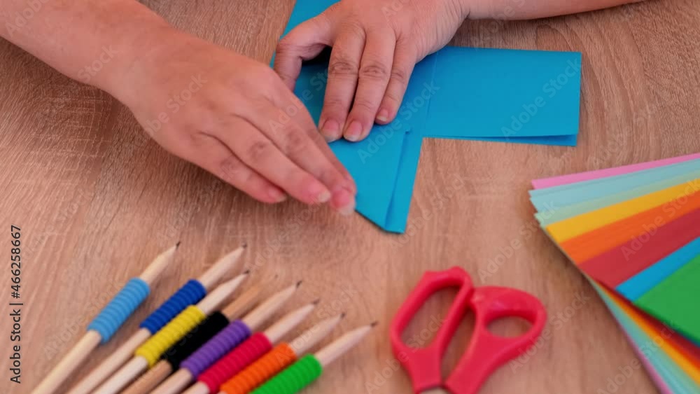 closeup woman holding colored paper, material for scrapbooking, origami ...