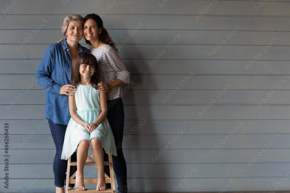 Happy family related women and kid hugging with love, care, support ...