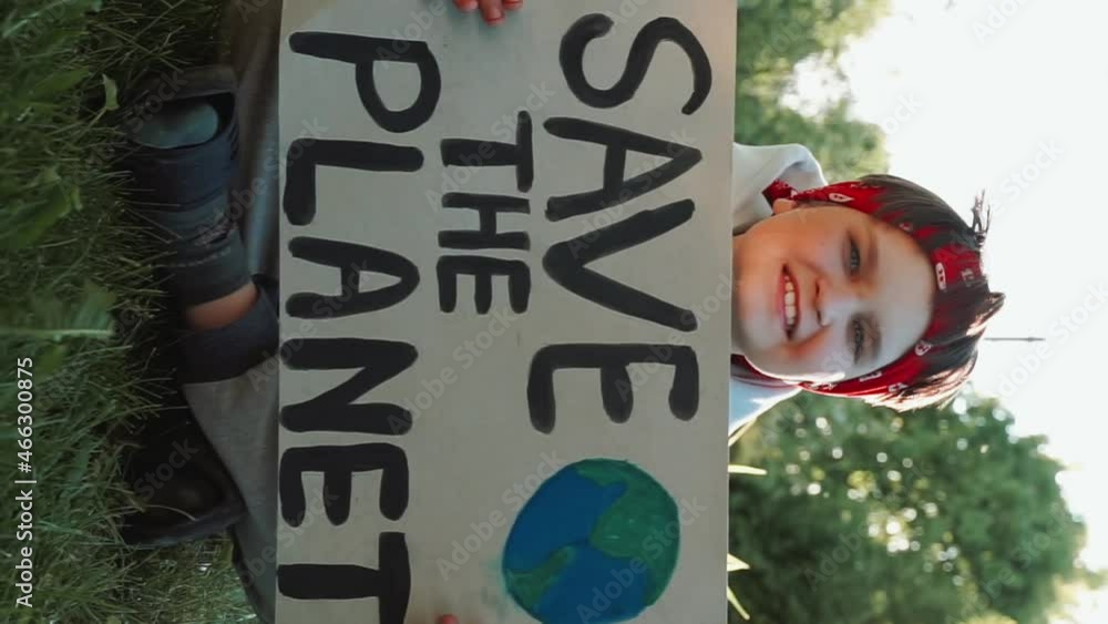 volunteer kids with Save the planet Poster. boy child activist holding ...
